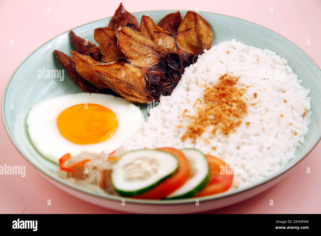 Photo of freshly cooked Filipino food called Daing Silog or dried fish served with fried rice ...