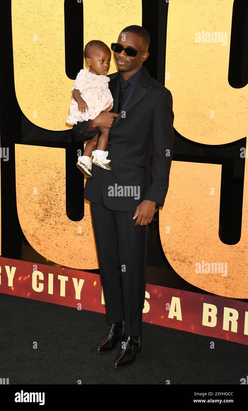 LOS ANGELES, CALIFORNIA - AUGUST 27: Christopher Ammanuel and child ...
