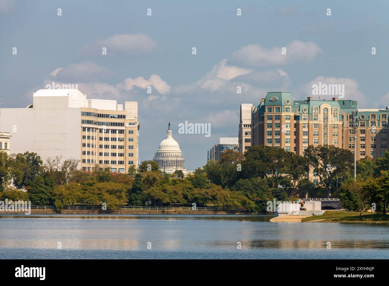 The United States Capitol framed by buildings and the waters of the ...