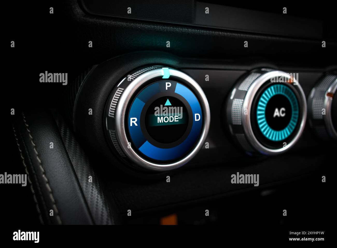 A rotary gear shift dial on the dashboard of an EV car or electric ...