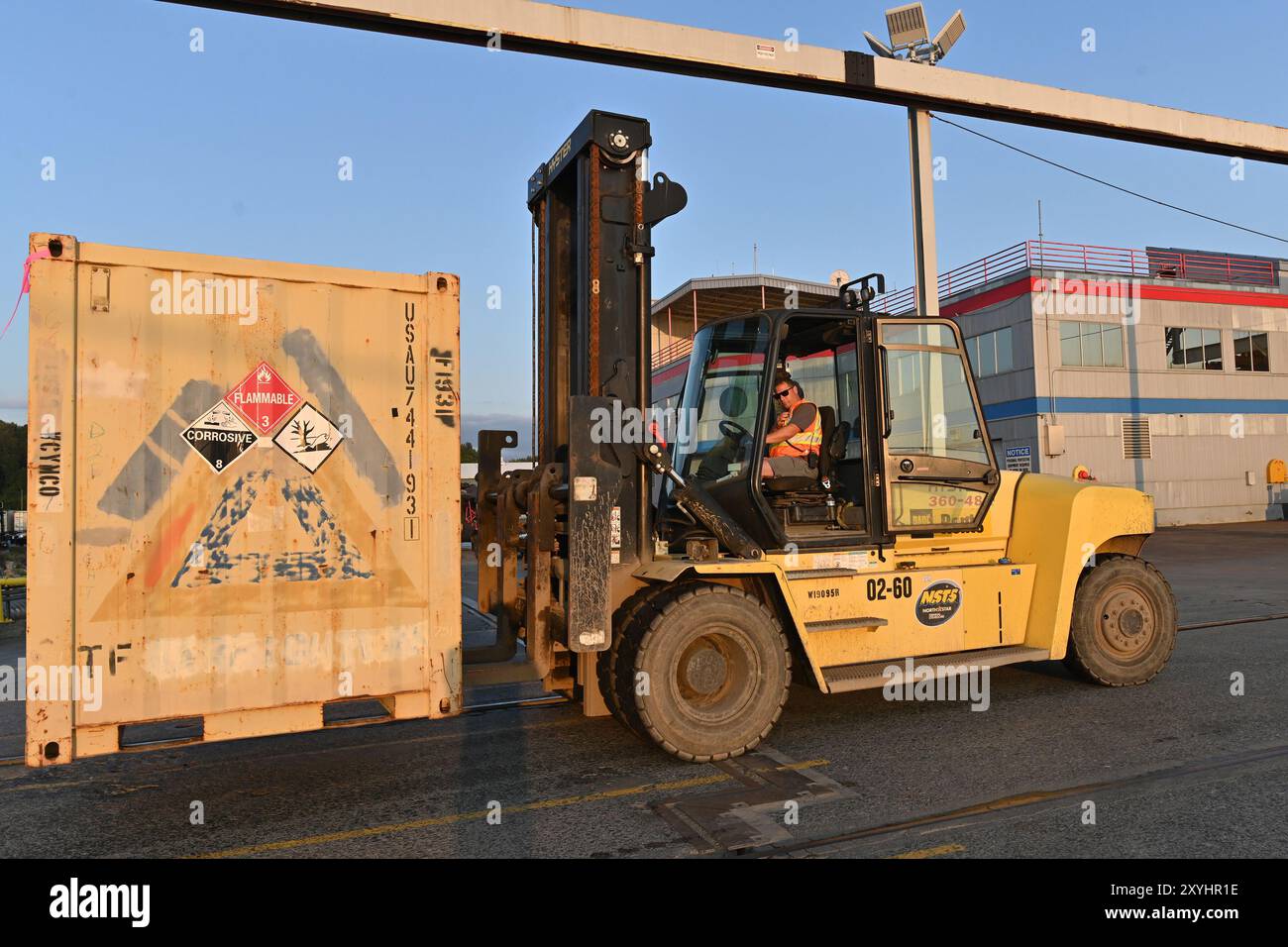 A stevedore unloads military equipment from the MV Cape Hope at the Don ...