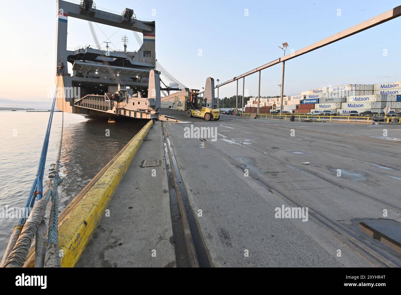 A stevedore unloads military equipment from the MV Cape Hope at the Don ...