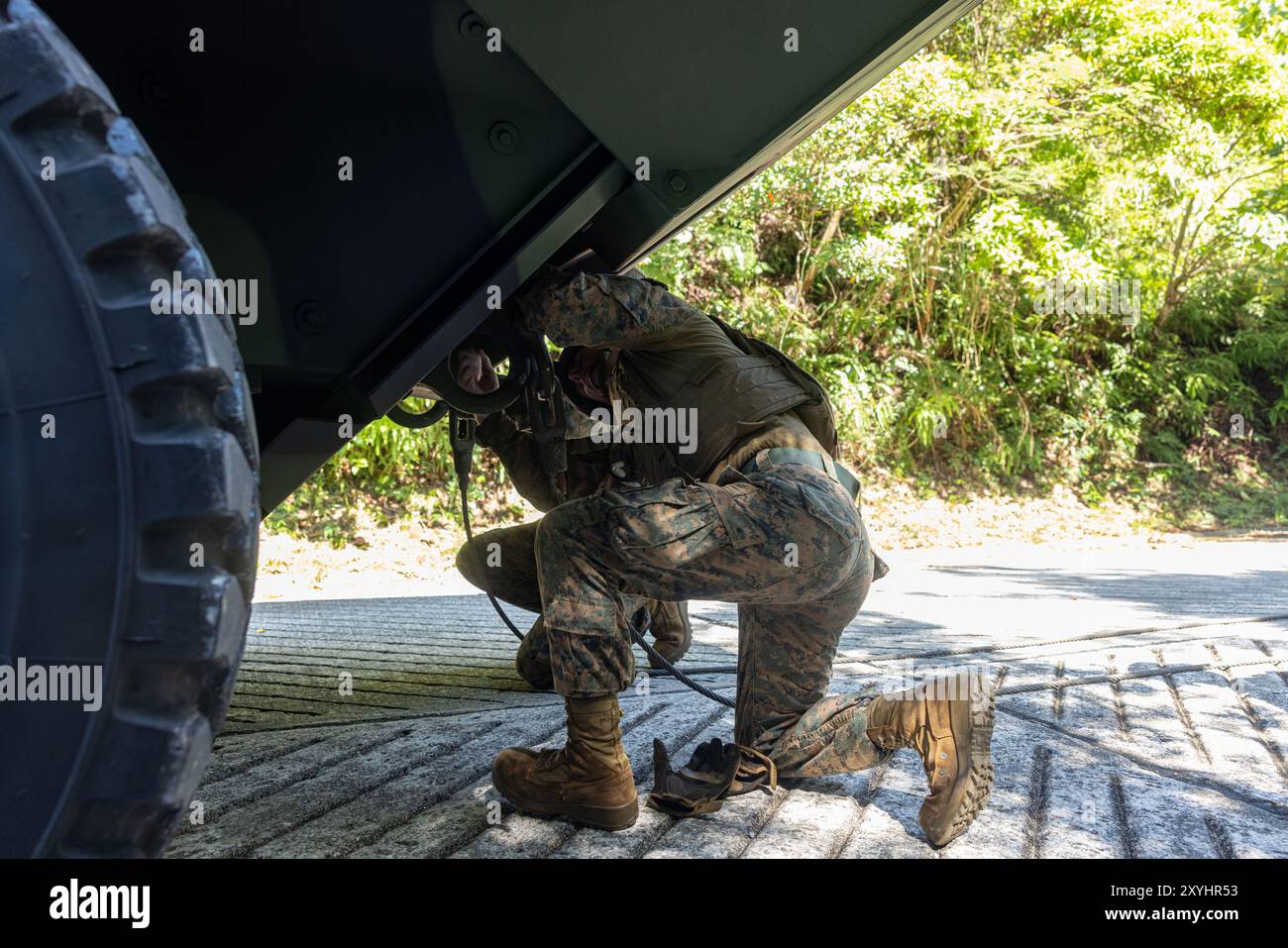 U.S. Marines prep an Amphibious Combat Vehicle for towing during route ...