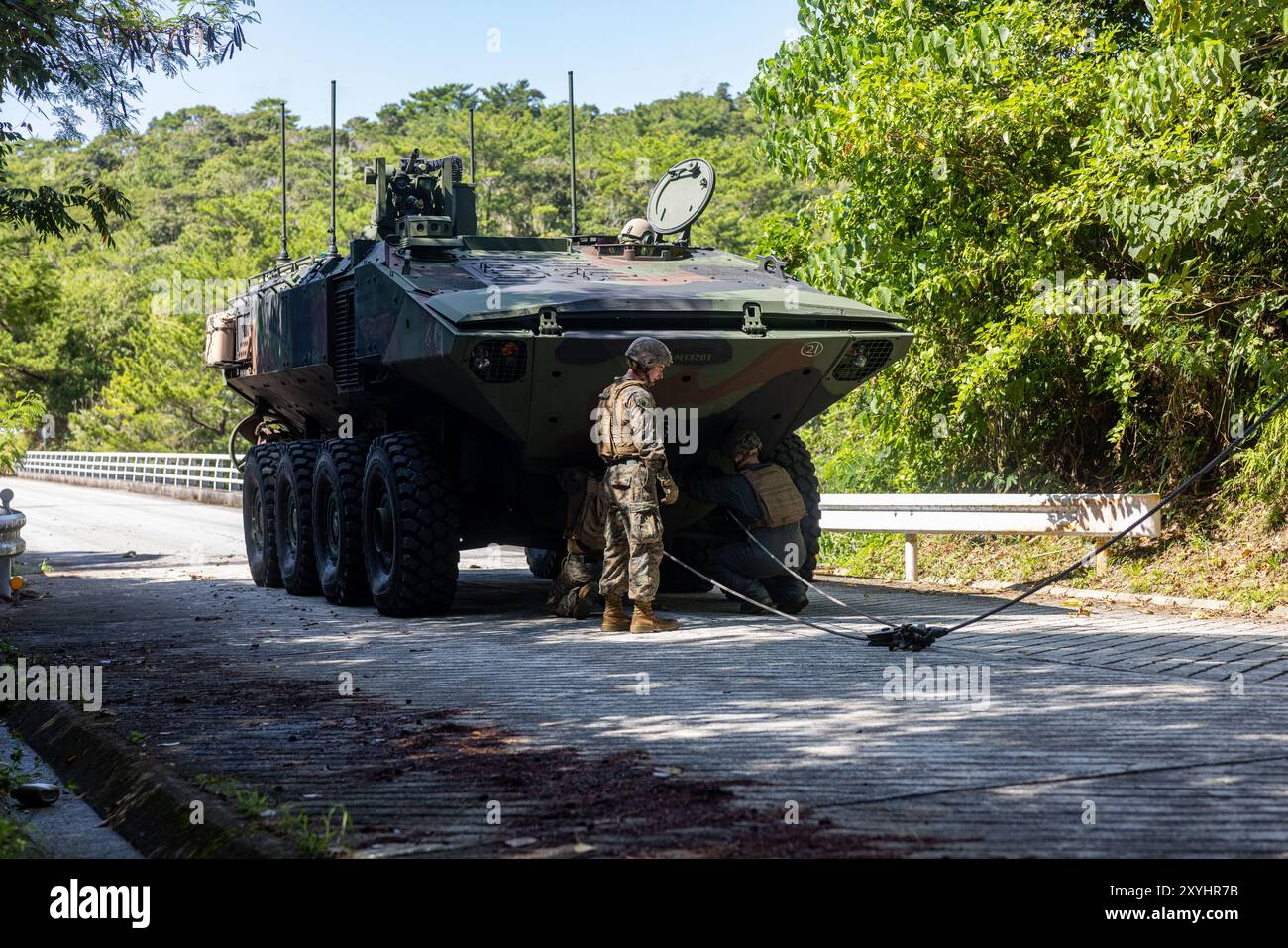 U.S. Marines prep an Amphibious Combat Vehicle for towing during route ...