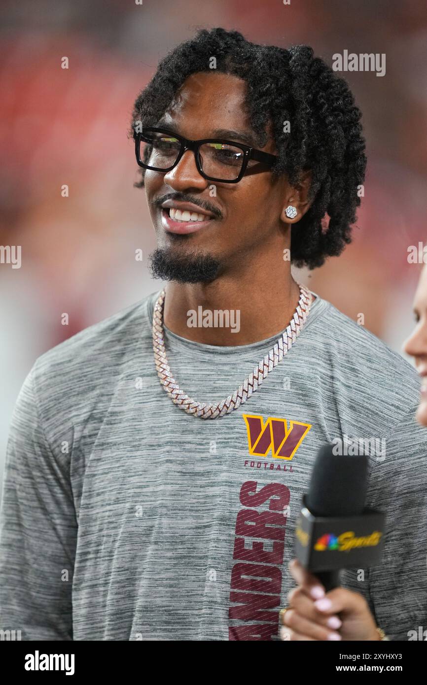 Washington Commanders quarterback Jayden Daniels (5) is interviewed on ...
