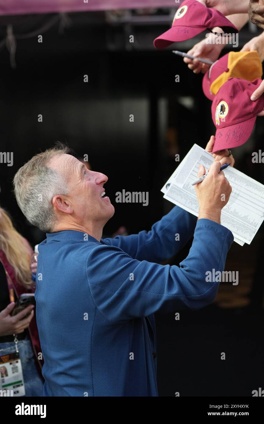 Washington Commanders owner Josh Harris signs an autograph before the ...