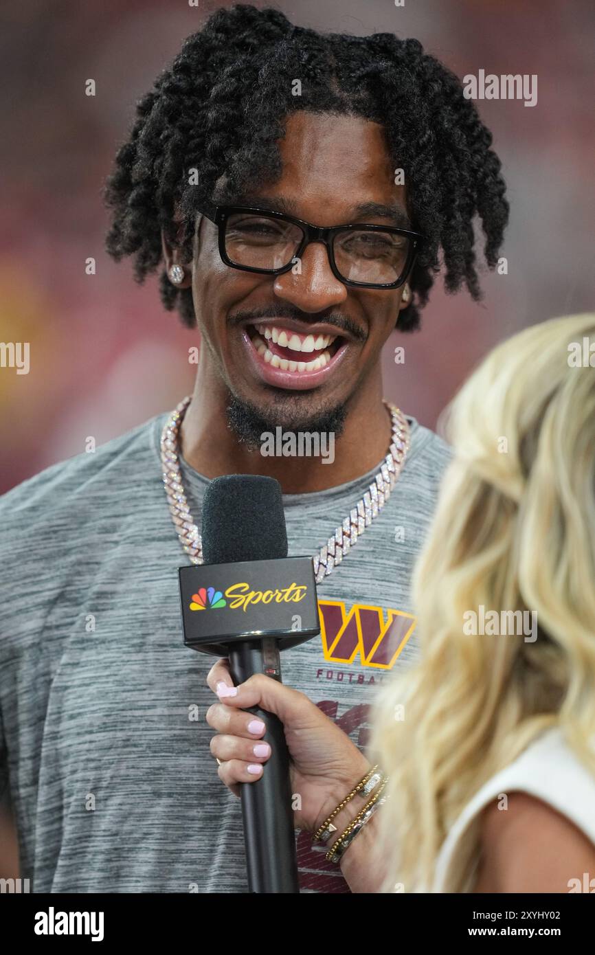 Washington Commanders quarterback Jayden Daniels (5) is interviewed on ...