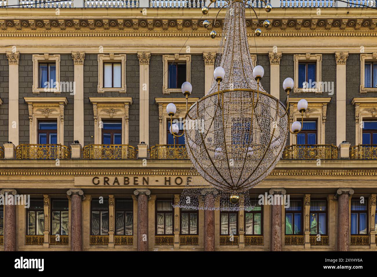 Christmas lights in the pedestrian zone, behind the facade of the ...