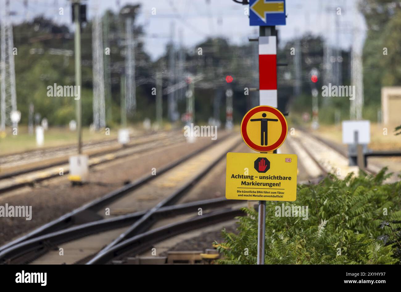 Deutsche Bahn AG warning sign for cable thieves: Attention, invisible ...