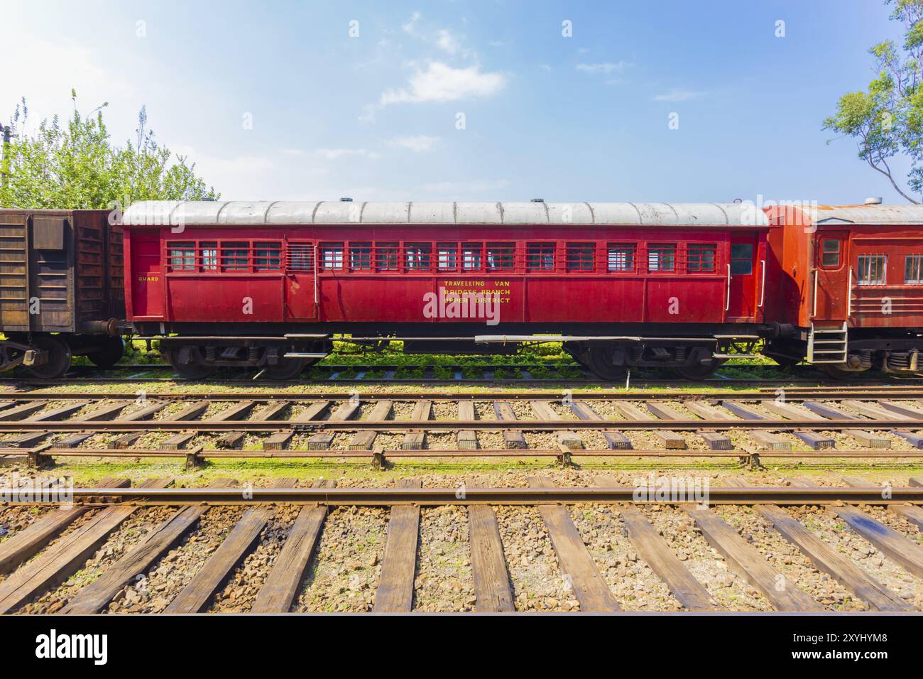 Side view of an old stationary red passenger carriage car sitting ...