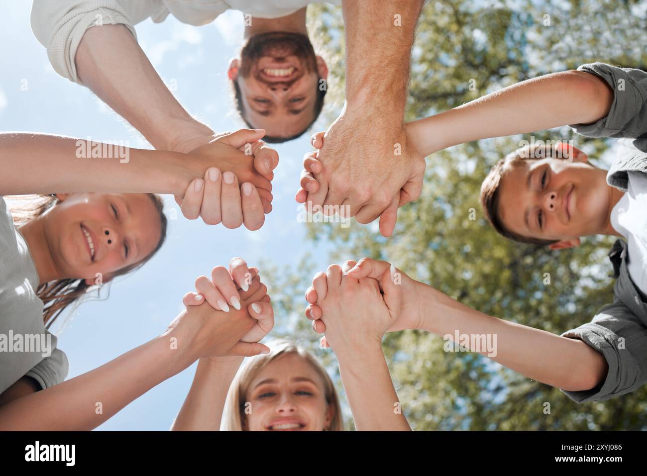 Family, huddle and children holding hands with portrait and smile from ...