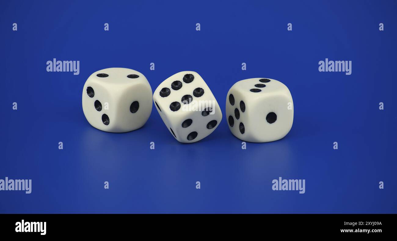 Gaming scenario scene with three dice with black spots situated on a ...