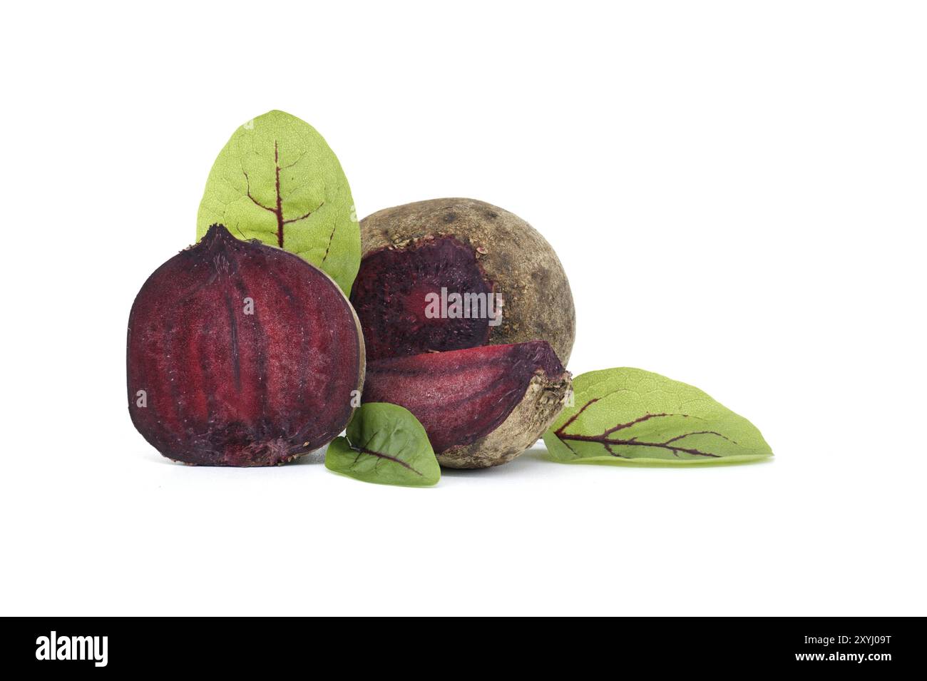 Collection of whole beetroot arranged next to slices of beetroot ...