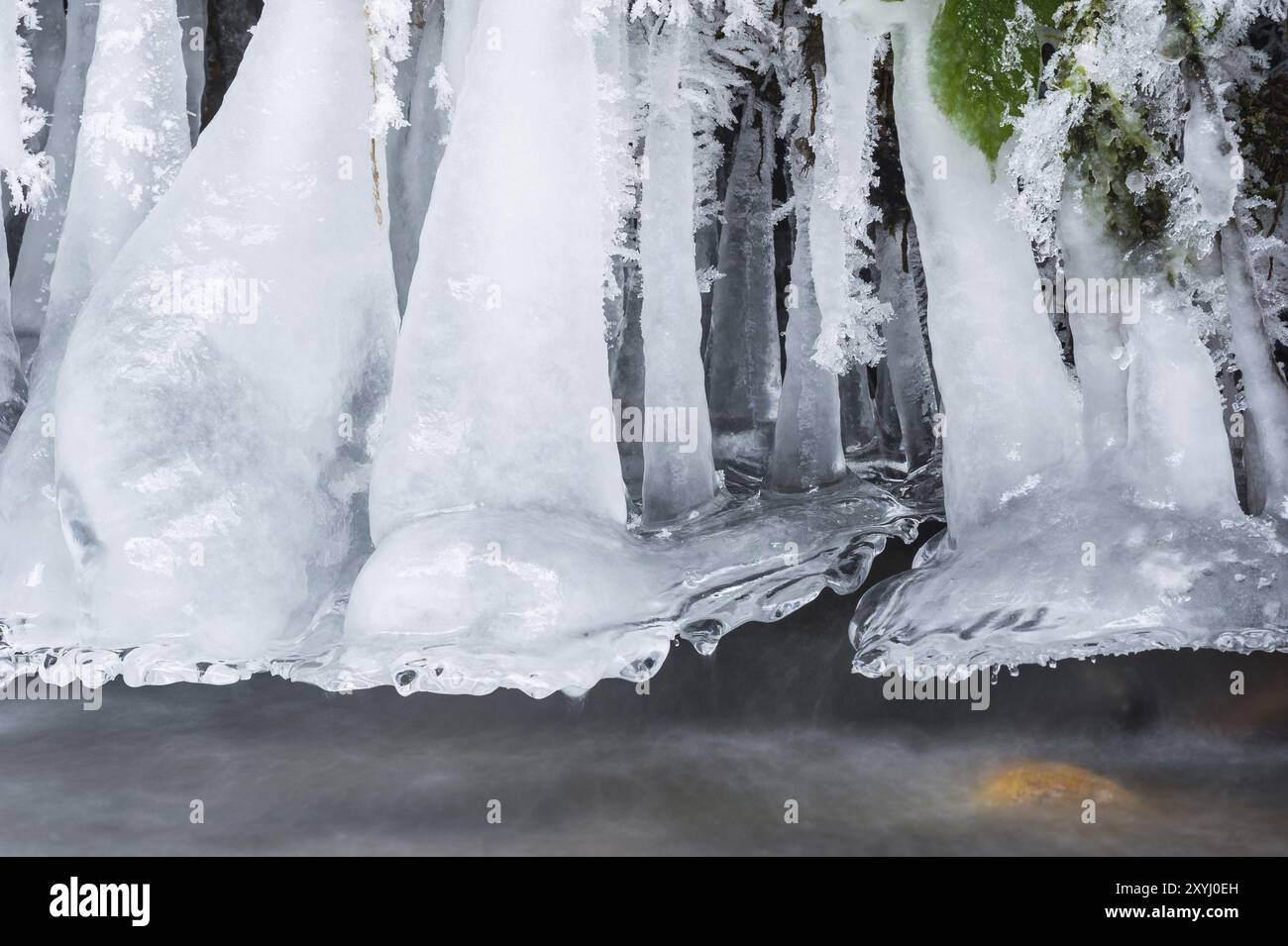 Hanging ice sculptures on a stream in Upper Franconia Stock Photo - Alamy