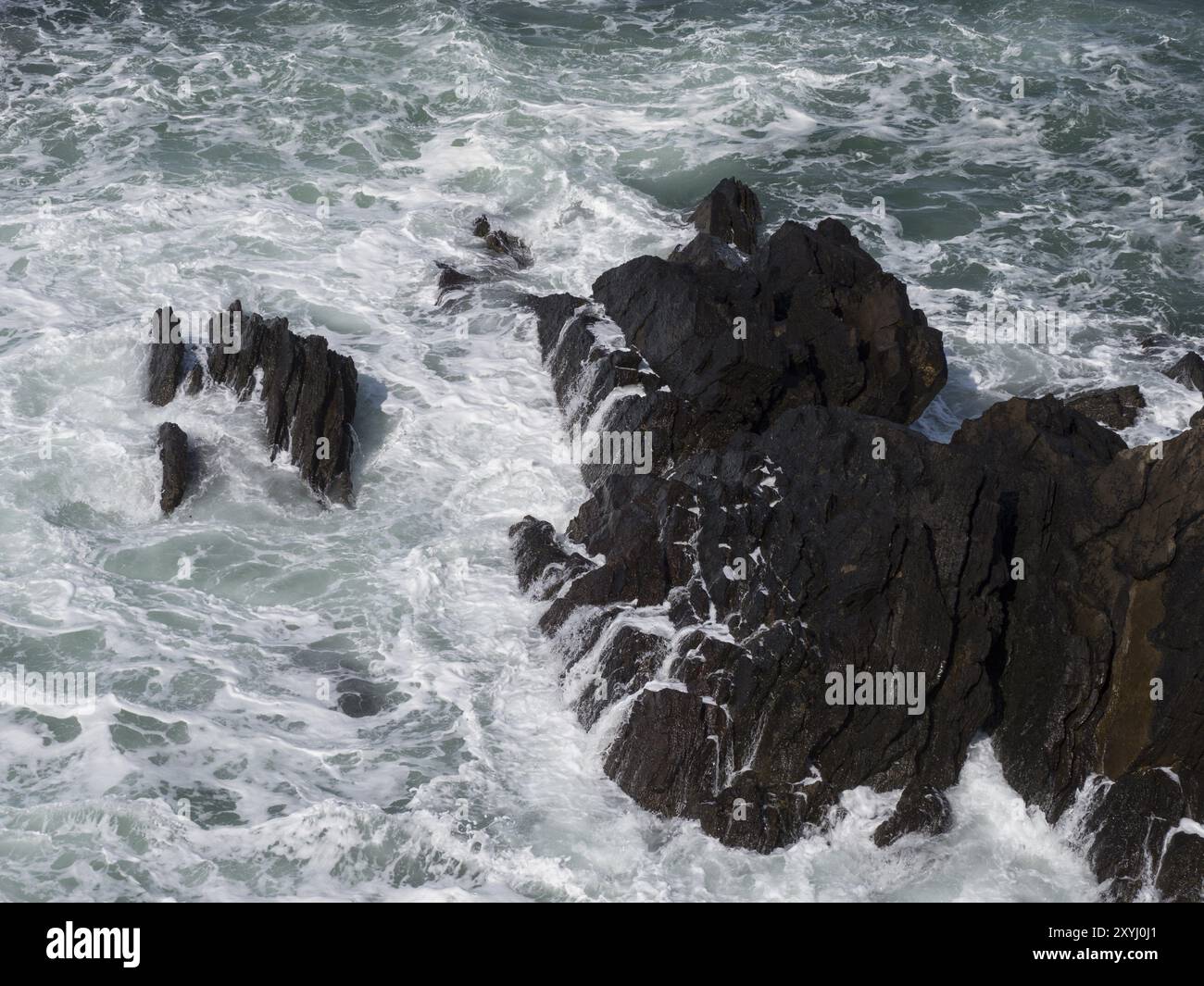 Surf on the cliffs of the Coastal National Park in Pembrokeshire, Wales ...