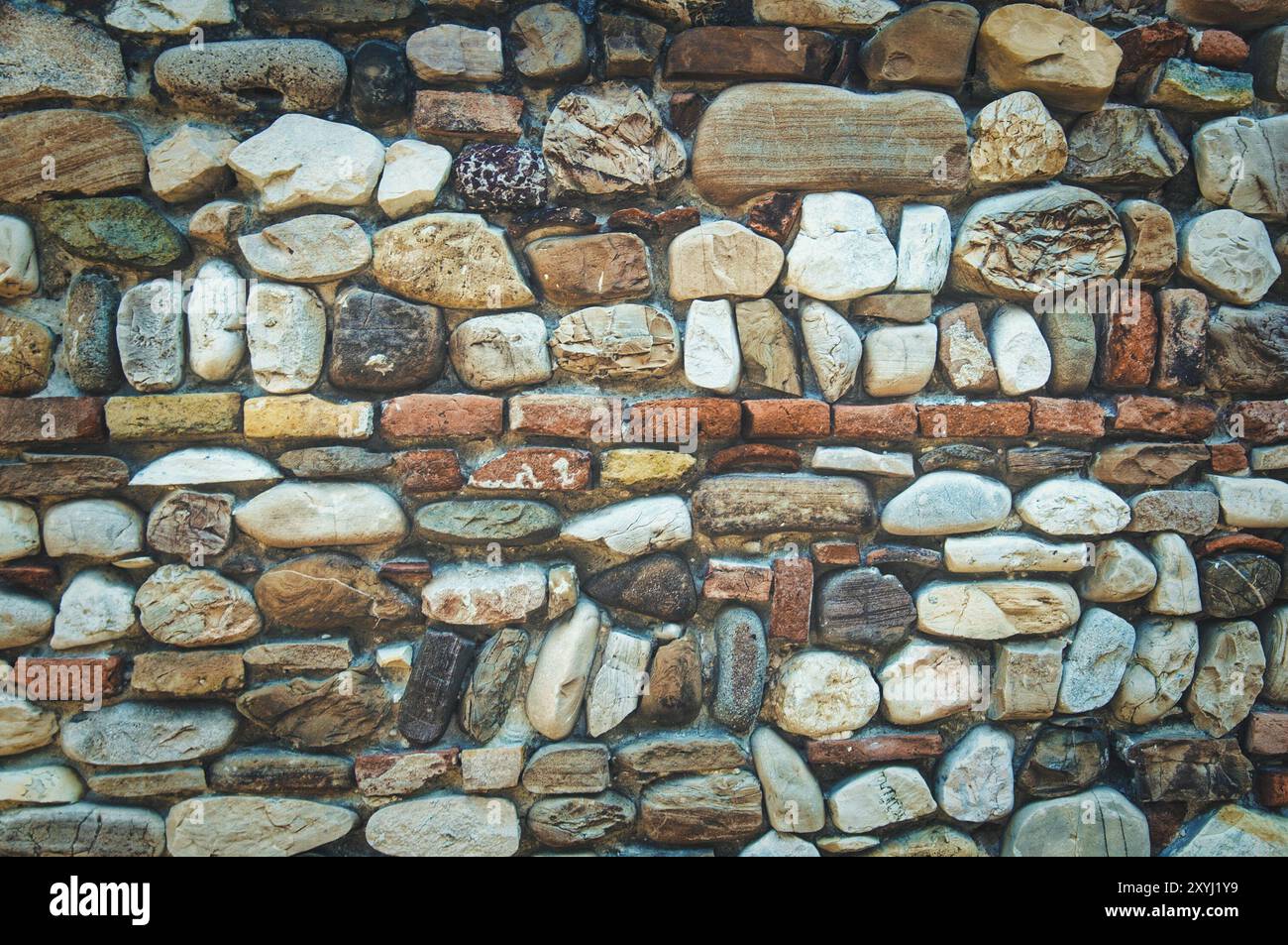 Ancient variegated stone wall Stock Photo - Alamy