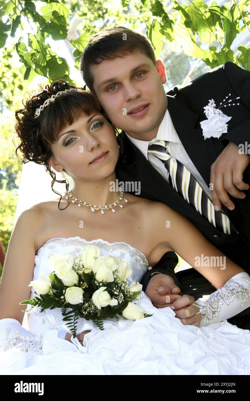 Newly married together in a photo pose Stock Photo - Alamy