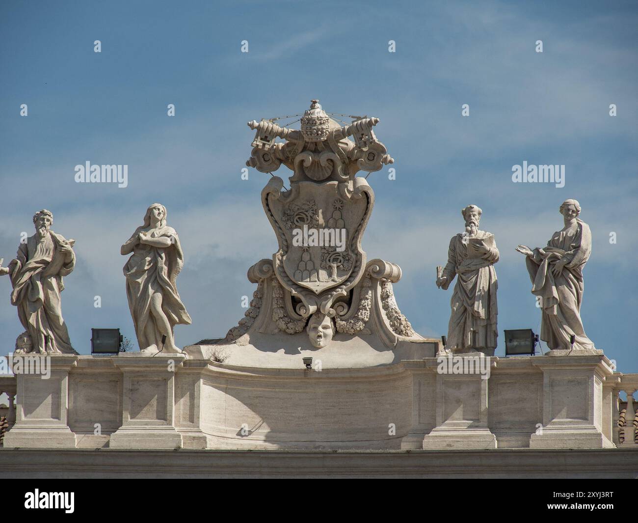 Coat of arms and several statues on an architectural building with a ...