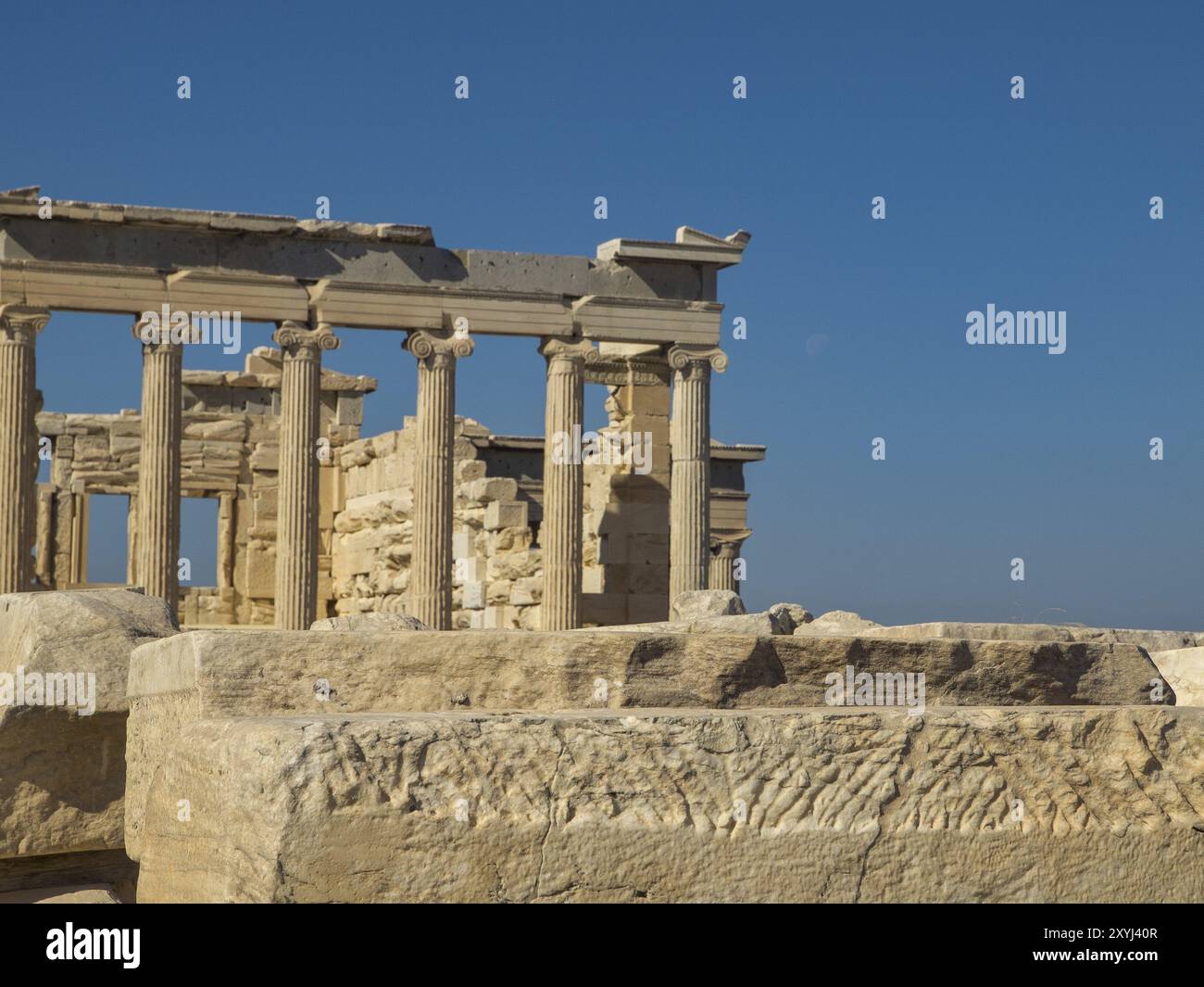 Ancient temple with columns and stone structures under a clear sky, athens, greece Stock Photo ...