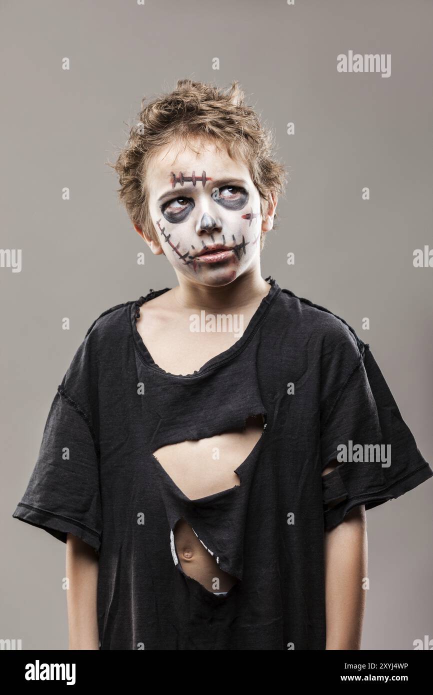 Halloween or horror concept, screaming walking dead zombie child boy ...