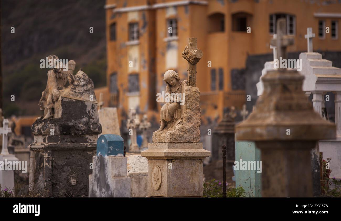 Gravestone in a large cemetery showing a little angelic girl sitting ...
