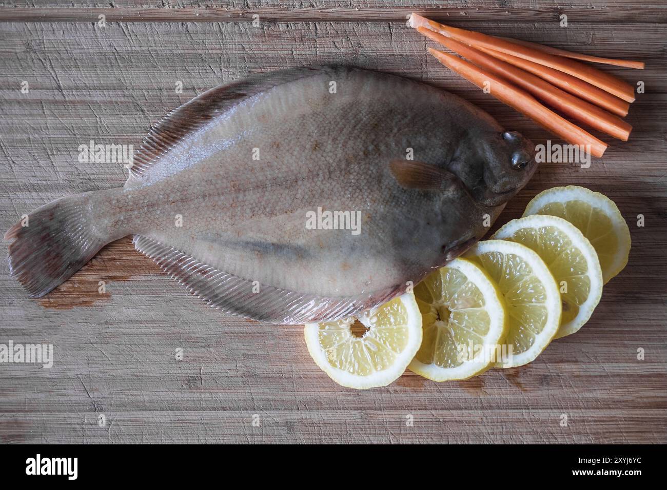 Fresh flounder with lemon and carrot Stock Photo - Alamy