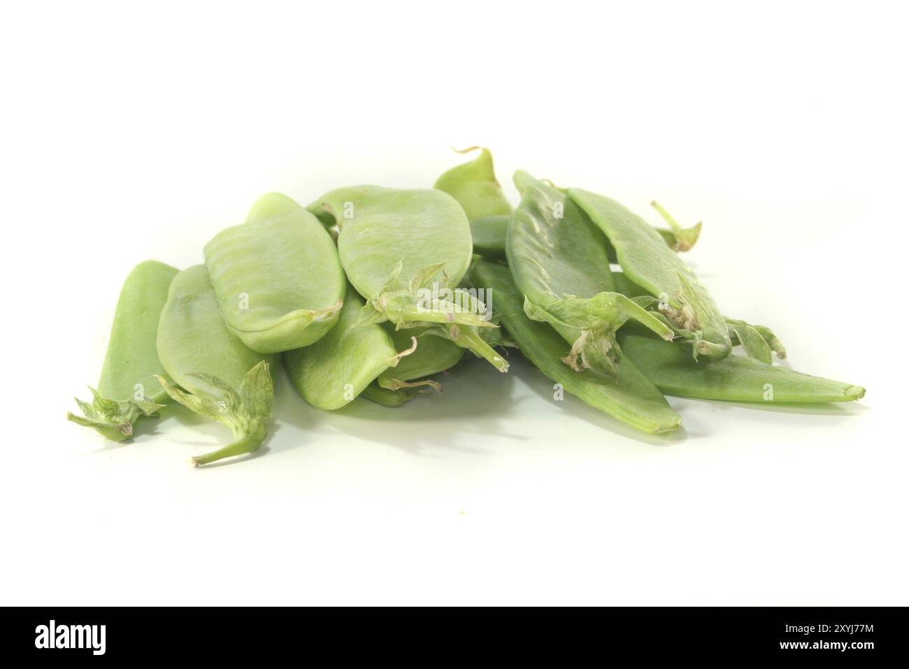 Sugar snap peas against a white background Stock Photo - Alamy