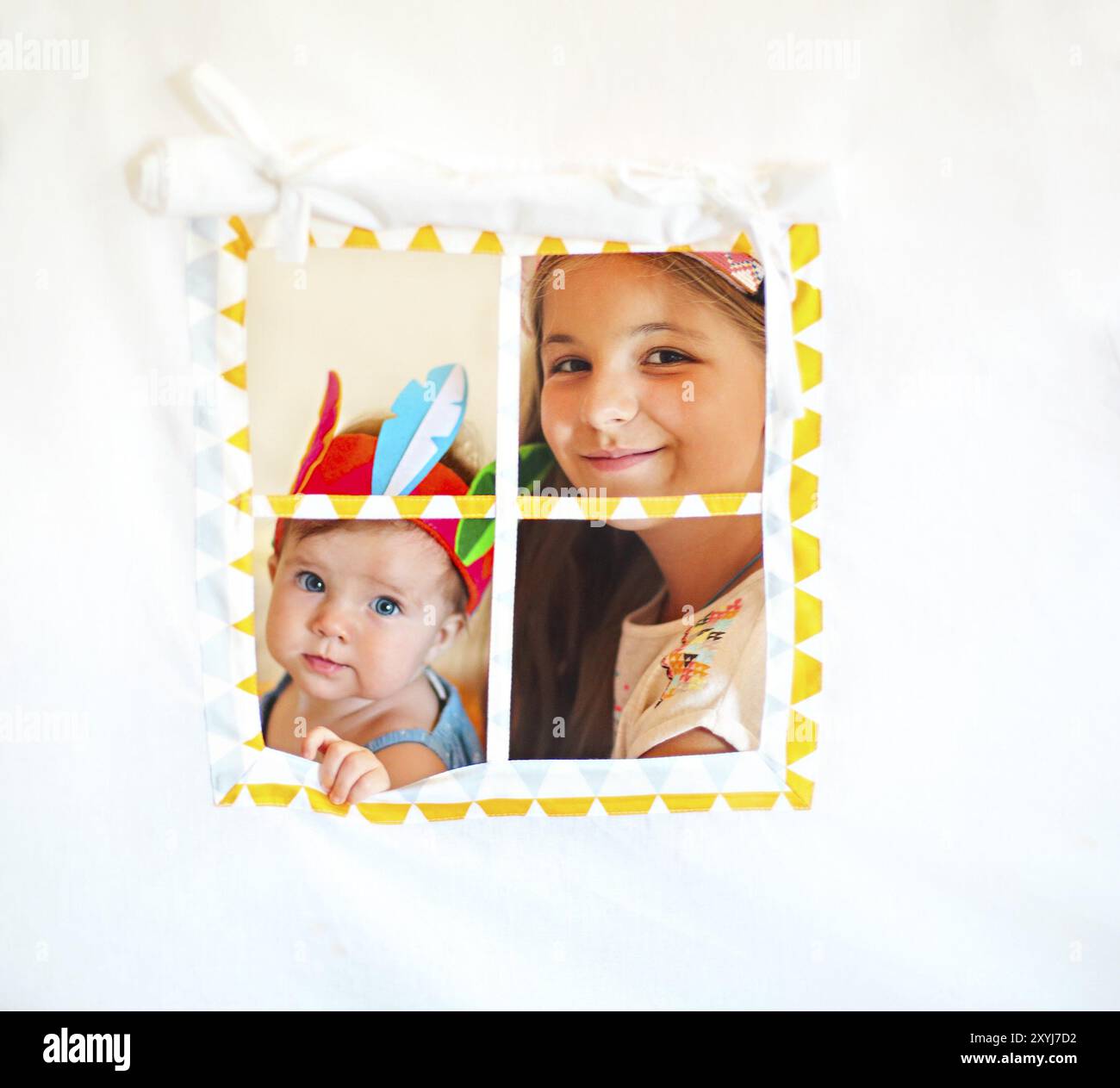 Two cute girl playing indians together indoors Stock Photo - Alamy