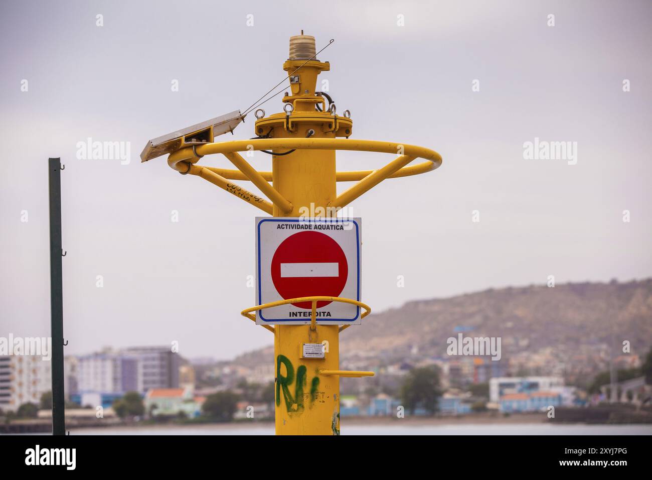 Yellow mast with traffic sign Stock Photo - Alamy