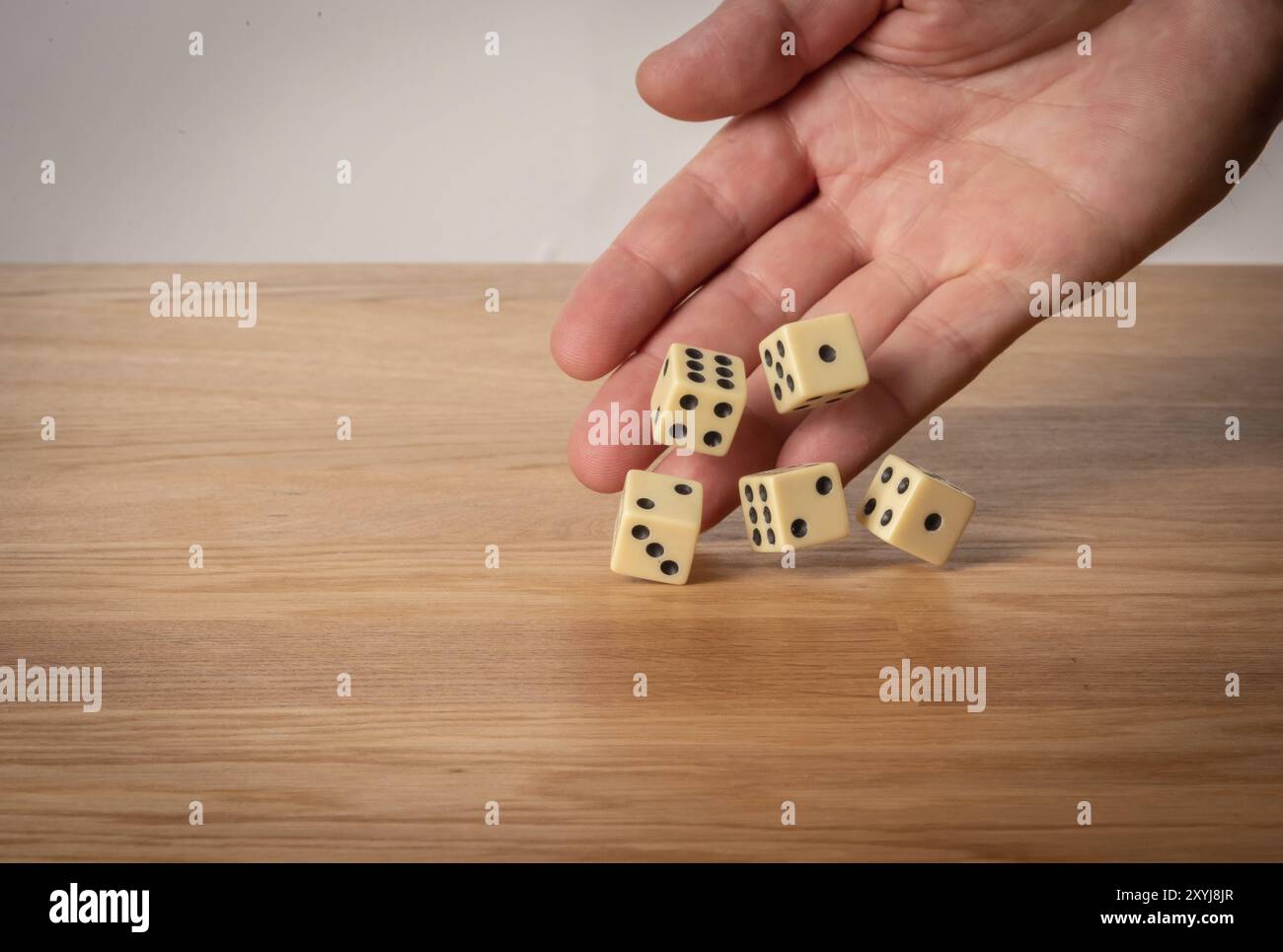 Hand in throwing dice hi-res stock photography and images - Alamy