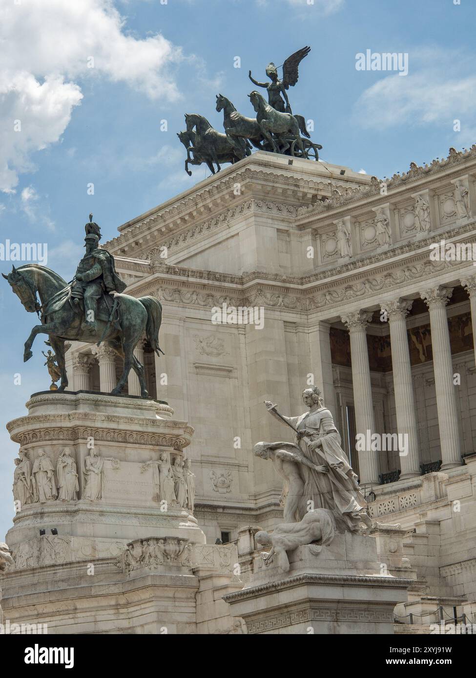 Equestrian statue on a high pedestal with other sculptures in a ...
