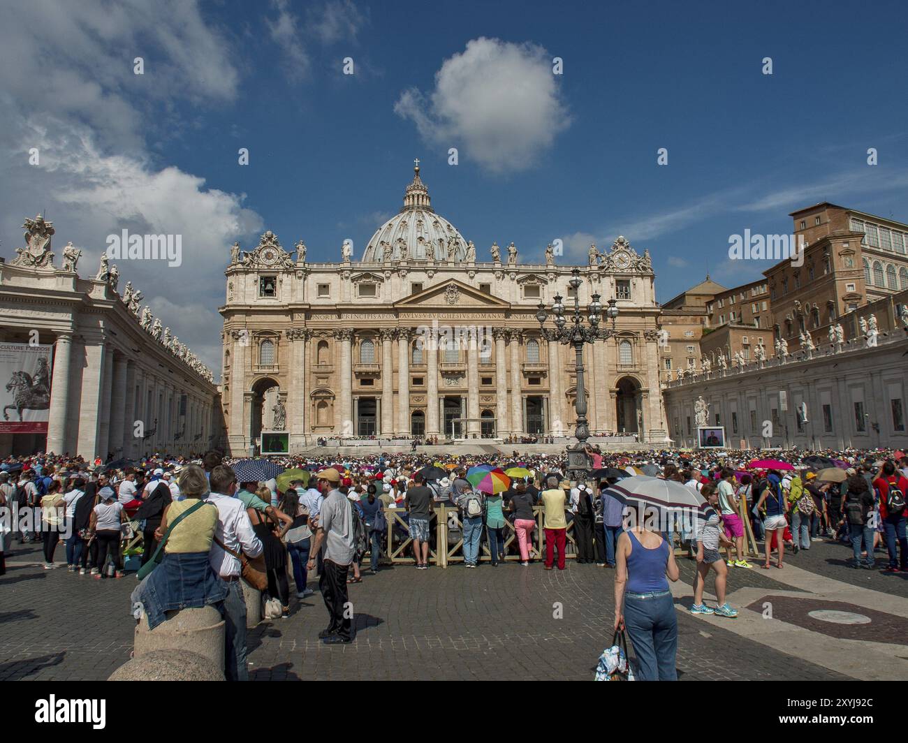 St Peter's Basilica with a large crowd in the square in front of it ...
