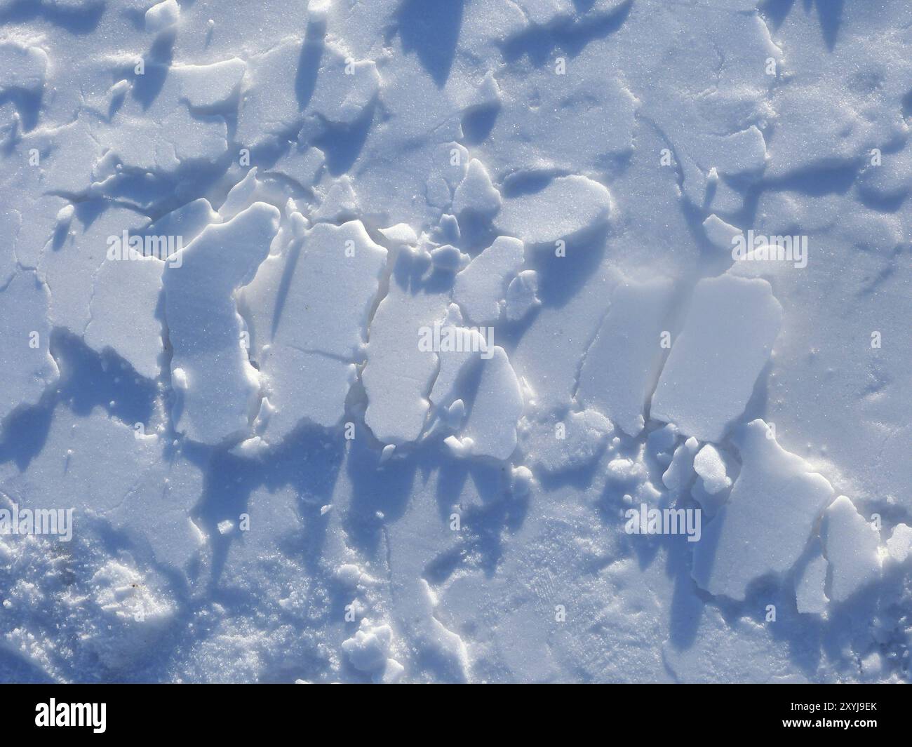 Winter background, snow texture, snowpack with partly broken surface ...