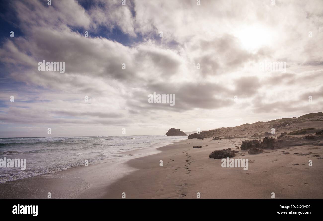 Beach section with shipwreck Stock Photo - Alamy