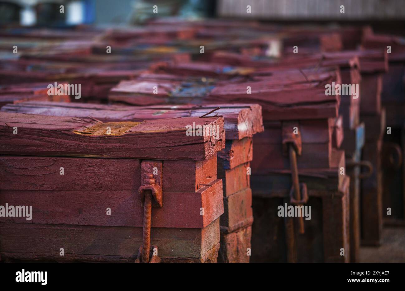 Brown wooden trunks standing at a dockyard Stock Photo - Alamy