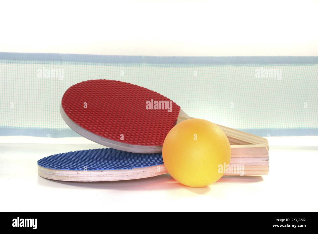 Two table tennis bats and ball on a white background Stock Photo - Alamy