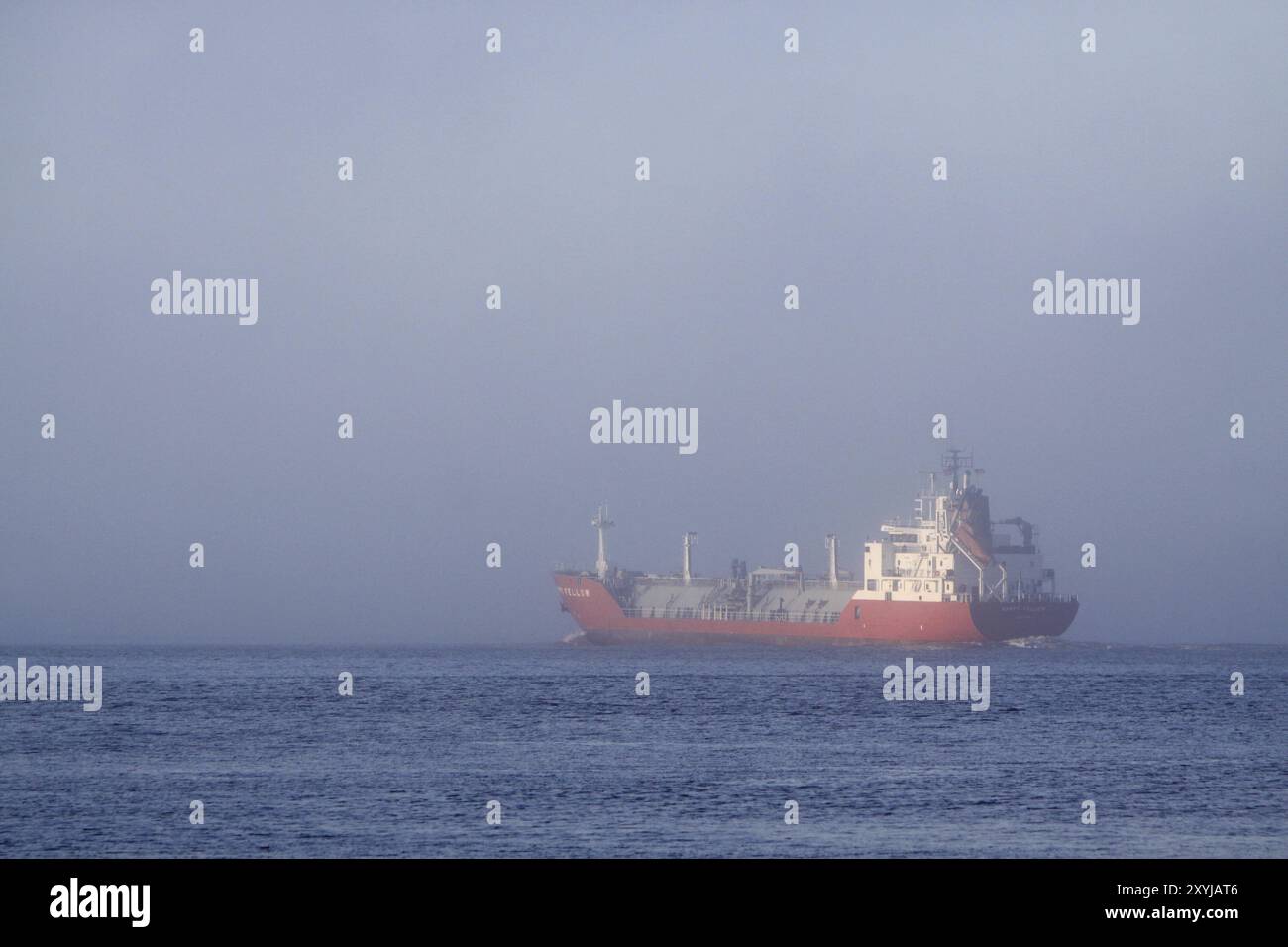 Cargo ship in the fog Stock Photo - Alamy
