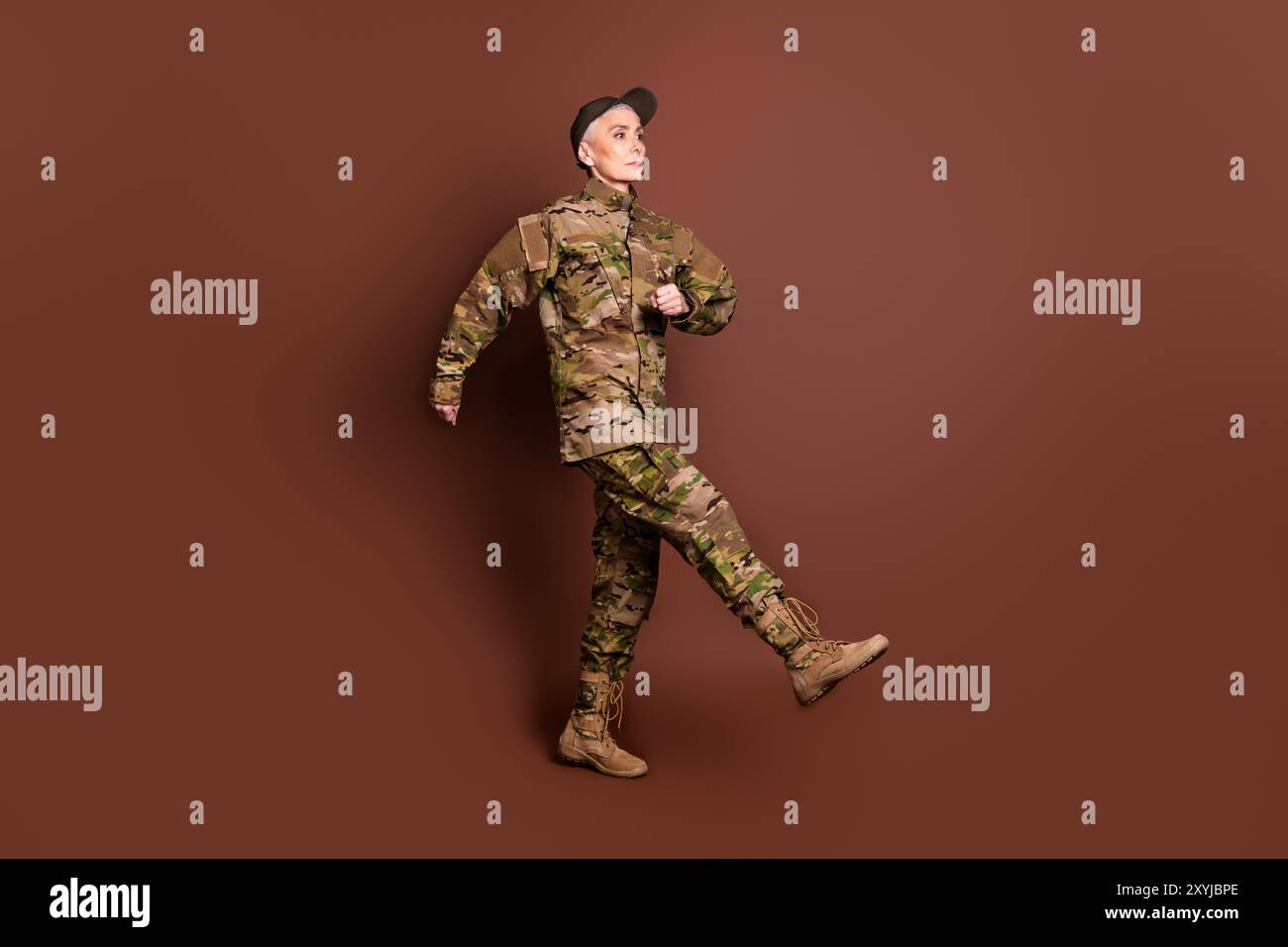 Full body photo of attractive mature woman army soldier walk marching ...