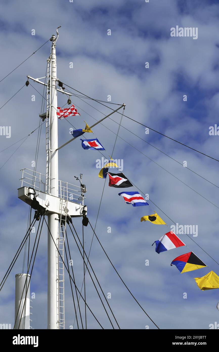 Mast of the ship and maritime signal flags Stock Photo - Alamy