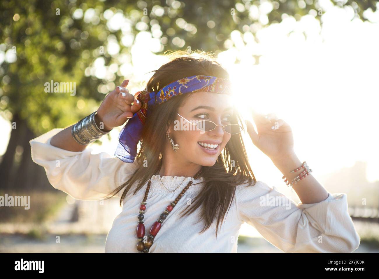 Happy slim tan woman in jeans dancing on the beach in sunset Stock ...