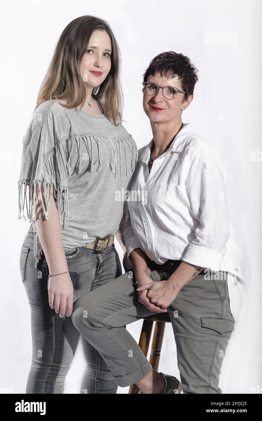 Portrait of two woman standing next to each other Stock Photo - Alamy