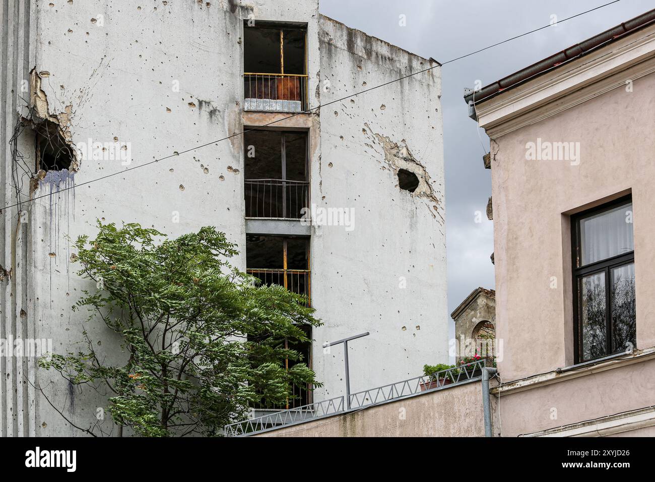 1992/1995 ex-Yugoslavia wars stigmata: bullet, shrapnel holes impacts on building wallS. War ...
