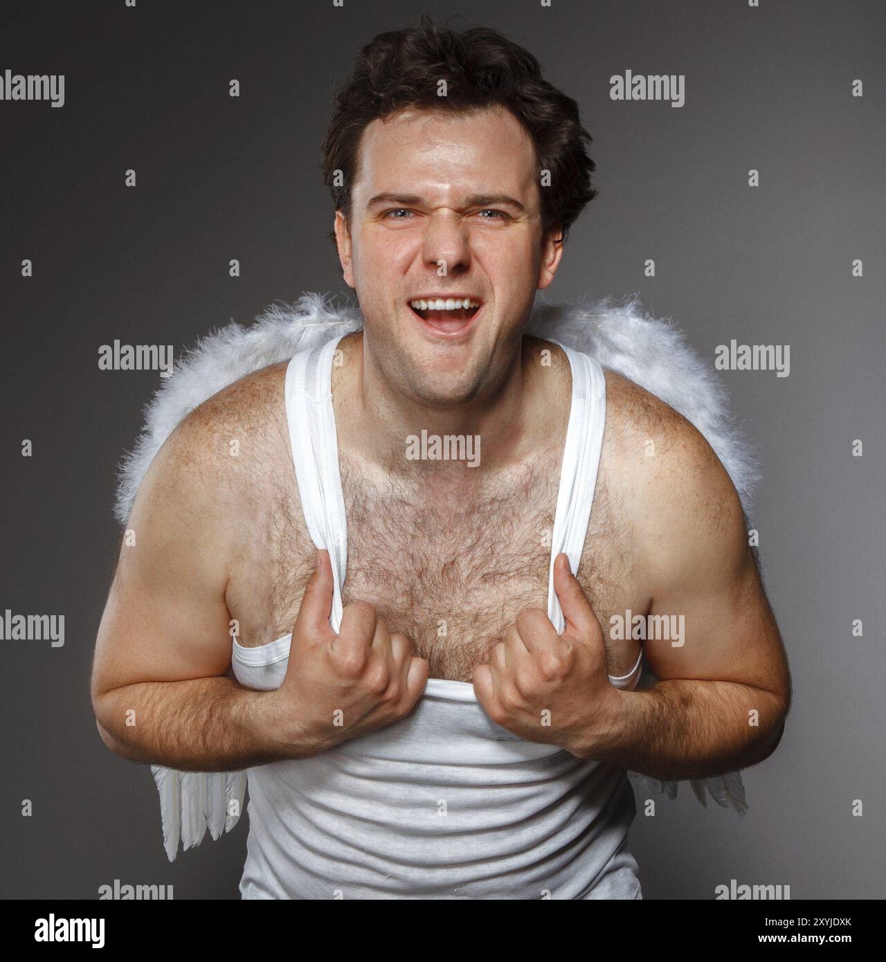 Mr. Angel with white wings. Crazy character portrait Stock Photo - Alamy