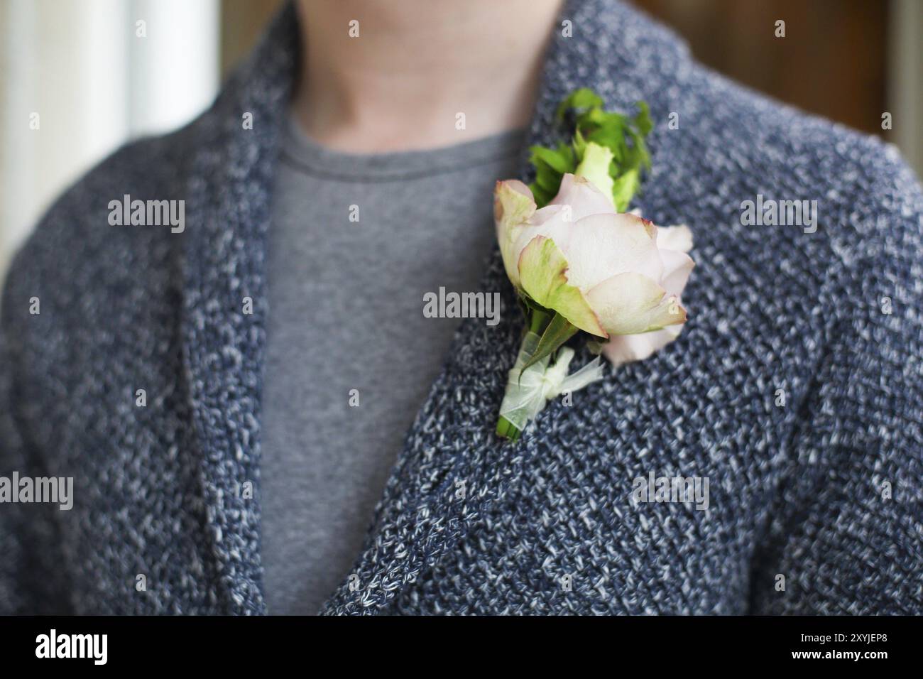 Gentle groom boutonniere with roses and beads. Close up Stock Photo - Alamy