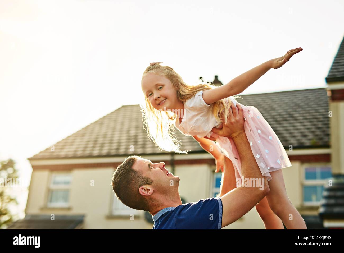 Father, girl and outdoor flying portrait on weekend, lifting child and ...