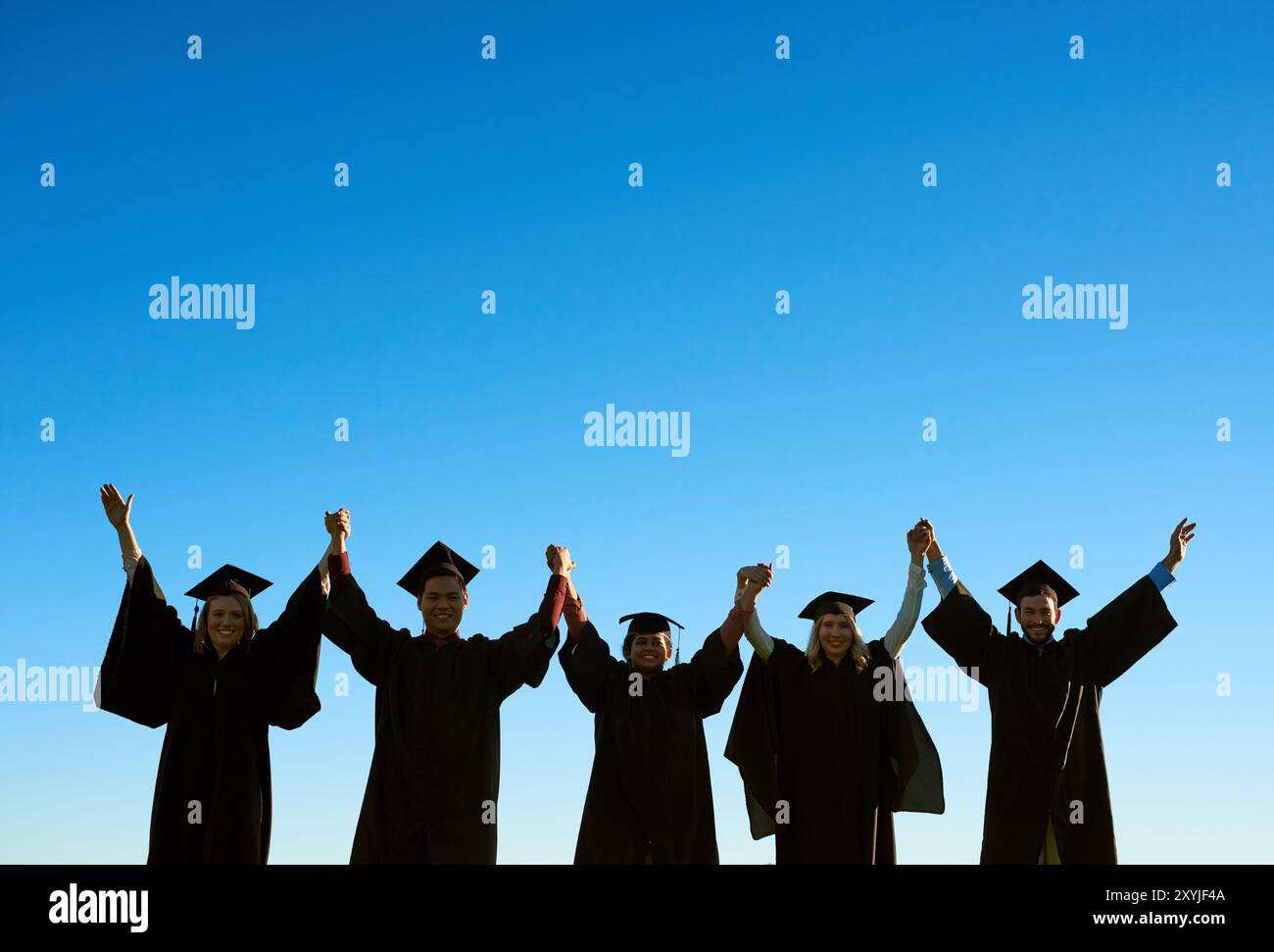 Education, graduation and hands raised with portrait of friends outdoor ...