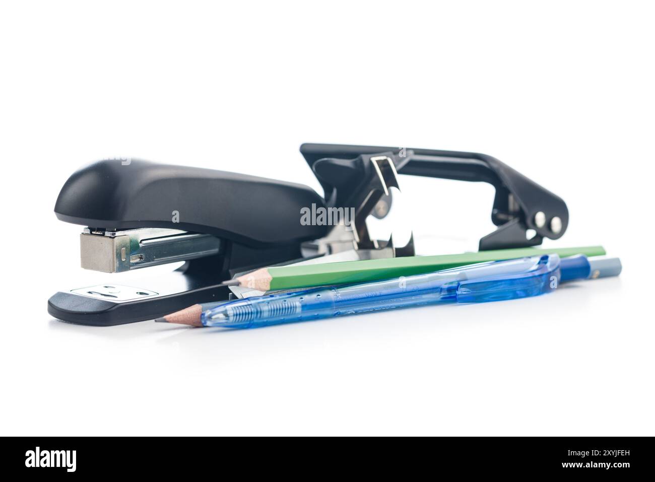 Office equipment. Stapler, pencils and hole puncher isolated on a white ...