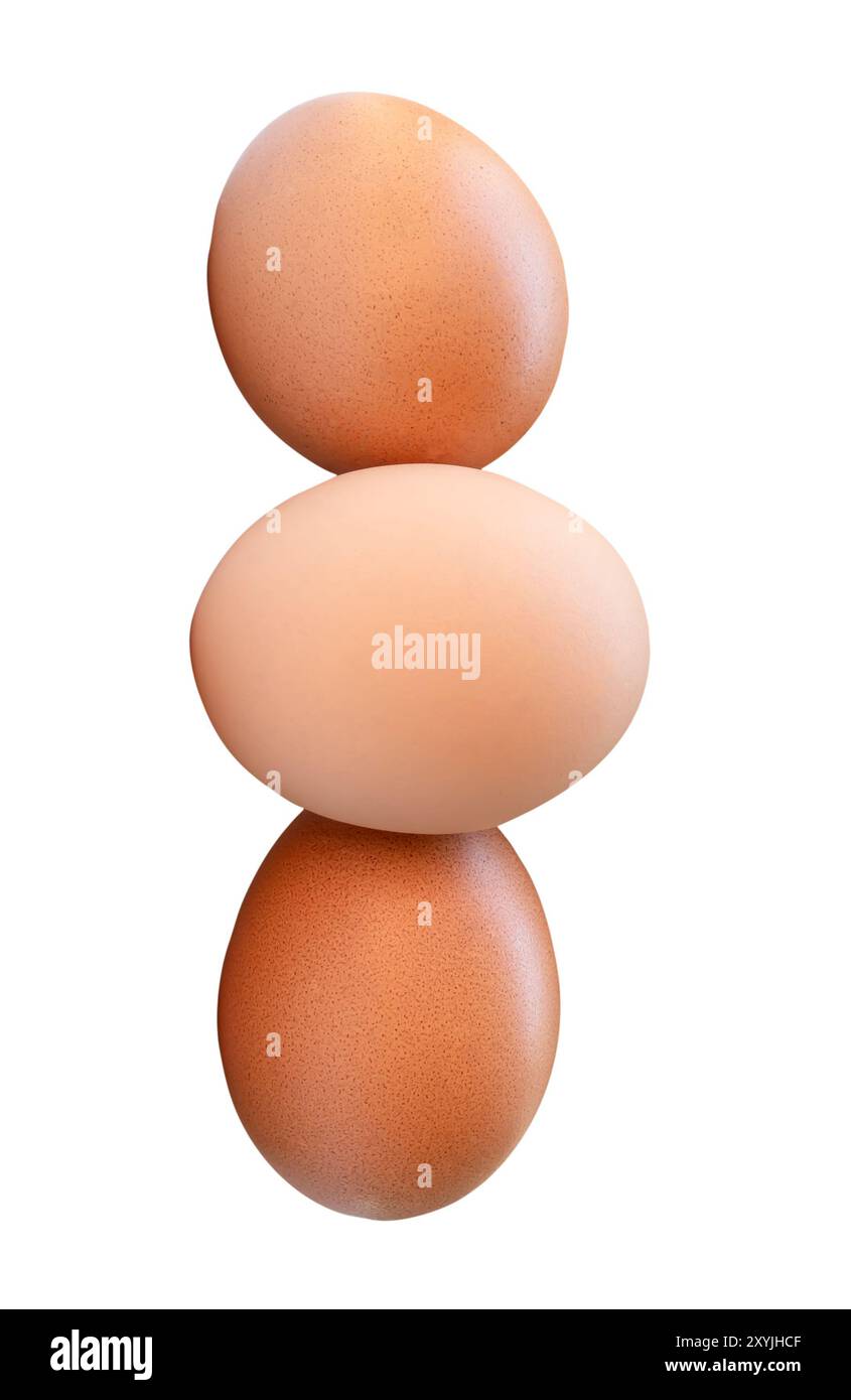 Three fresh brown chicken eggs in stack are isolated on white ...