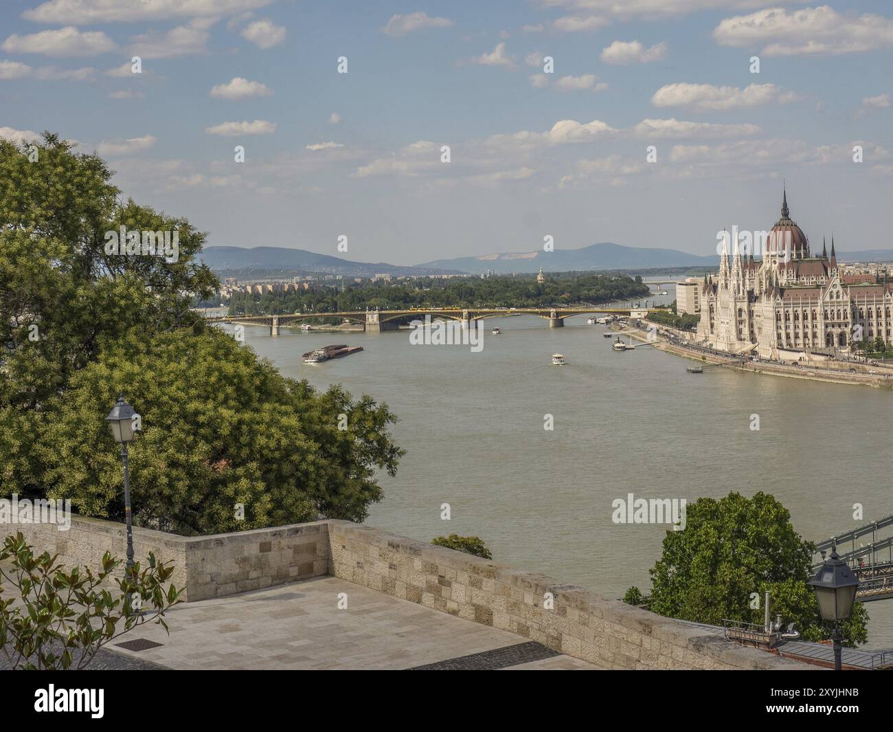 View of a historic parliament building by the river, surrounded by ...