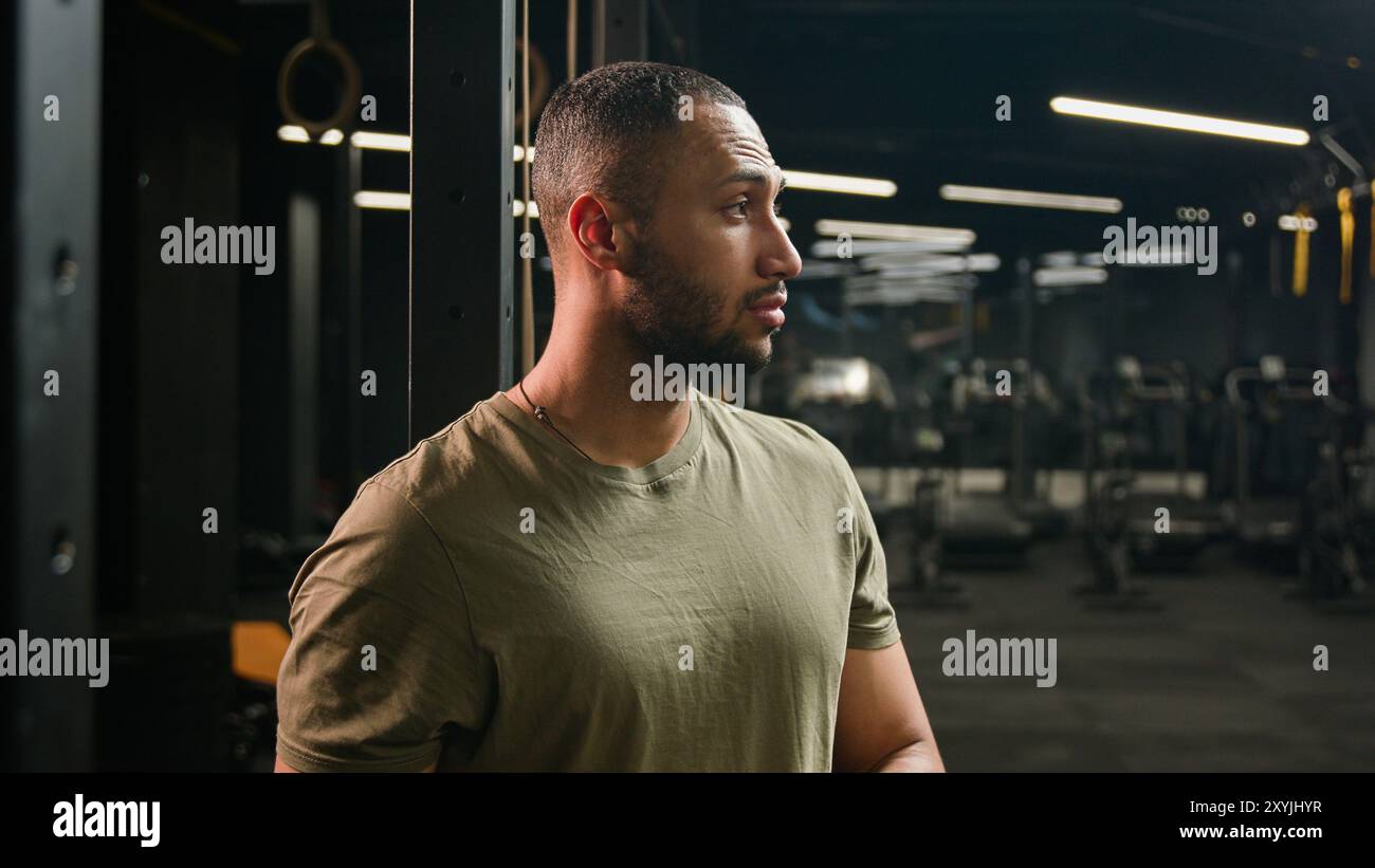 Strong muscular smiling personal fitness trainer guy African American ...